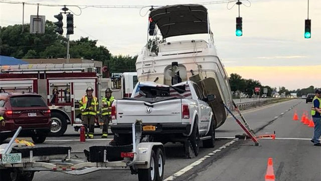 Boat breaks free, crashes onto truck towing it, officials say | WSB-TV